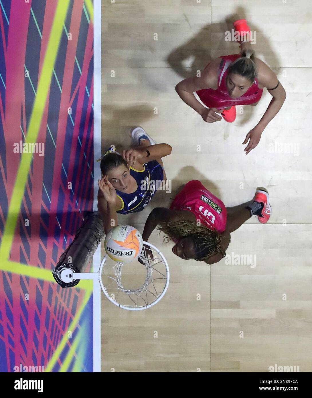 Leeds Rhinos' Ellie Bird (left) shoots during the Netball Season Opener ...