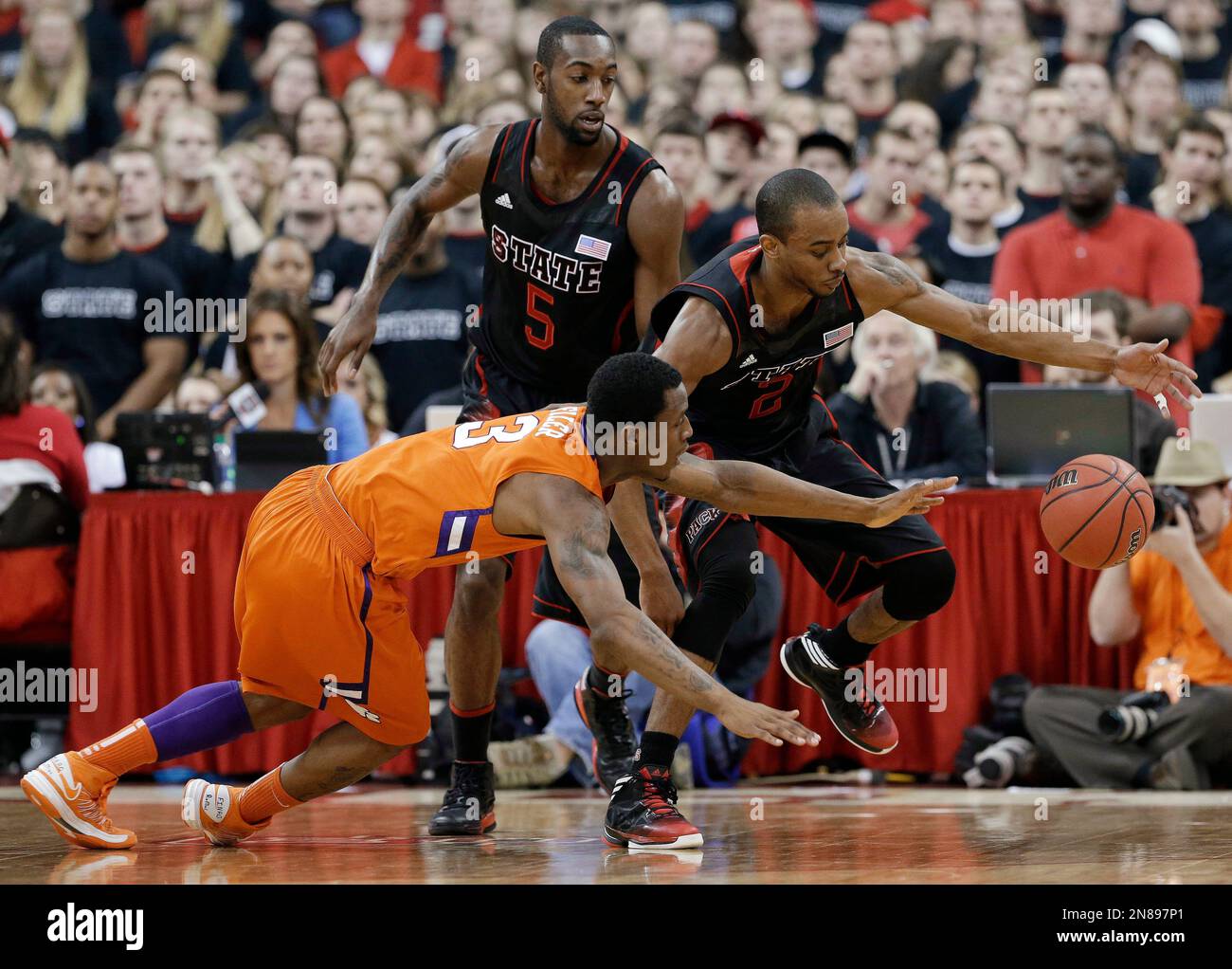 North Carolina State's Lorenzo Brown (2) and C.J. Leslie (5) chase a ...
