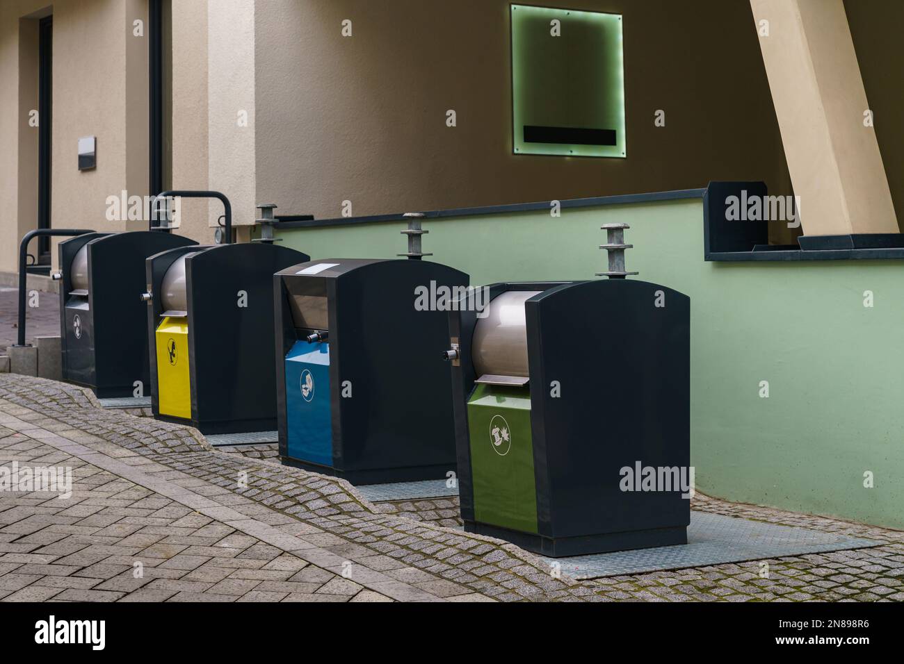 Stylish metal trash containers near the building Stock Photo - Alamy