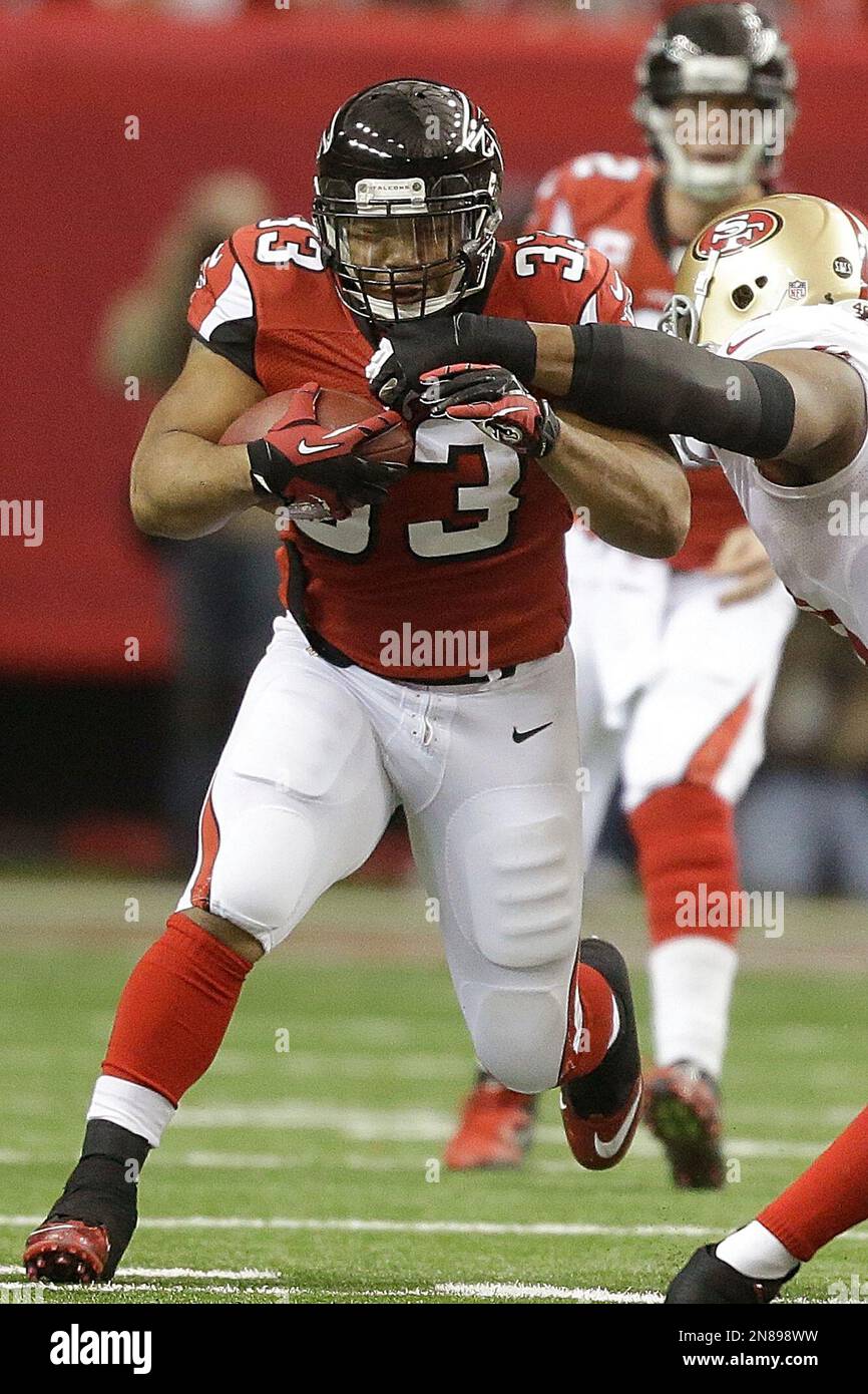 Atlanta Falcons running back Michael Turner carries the ball during the first half of the NFL ...