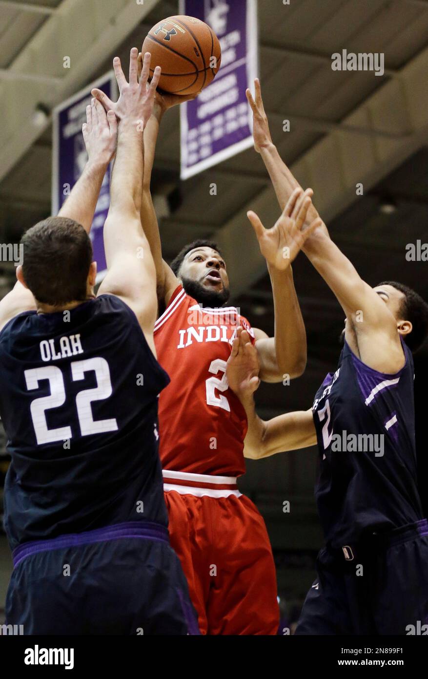 Indiana forward Christian Watford, center, shoots over Northwestern ...