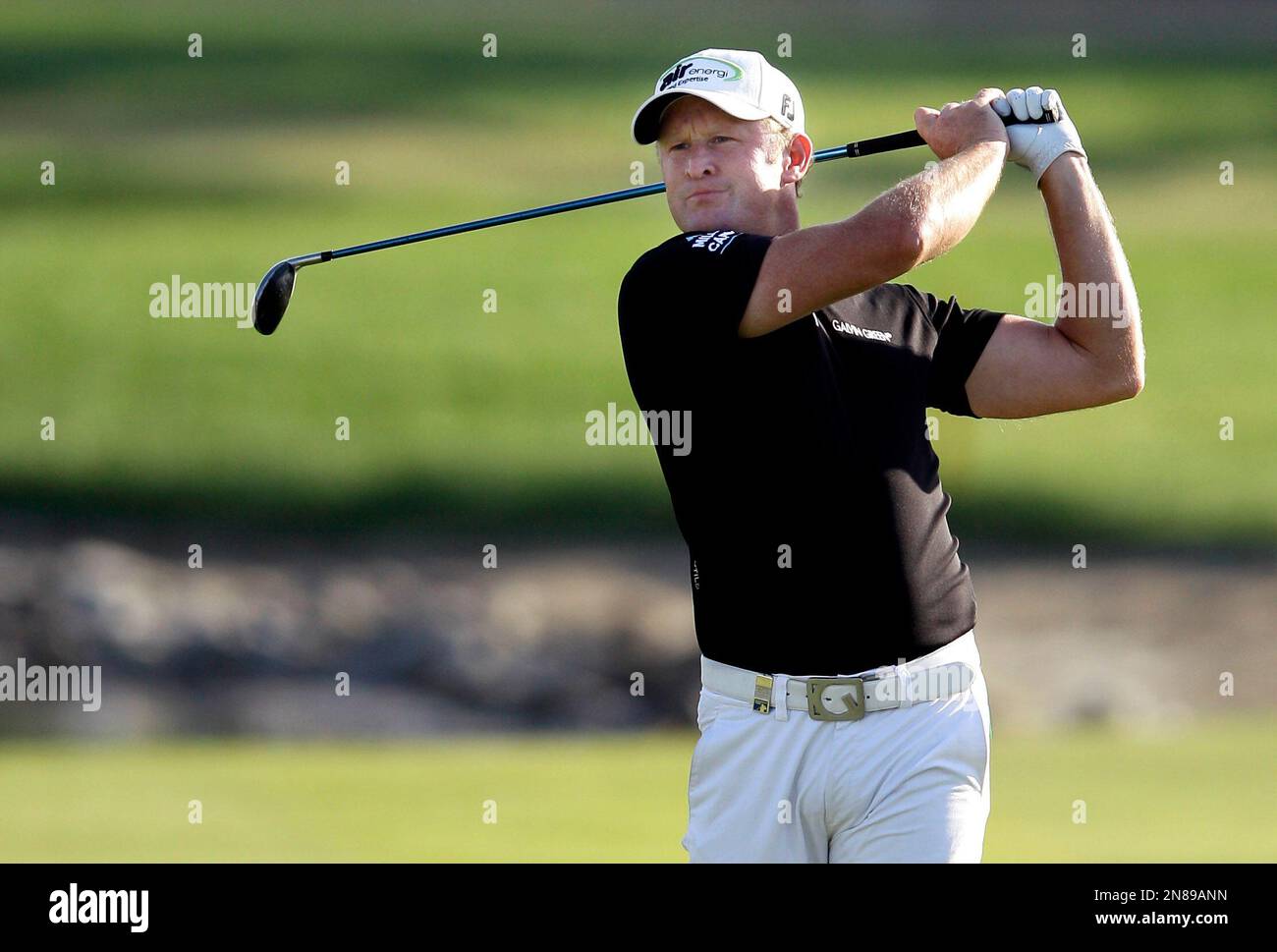 Jamie Donaldson from Wales follows his ball on the 16th hole during the ...