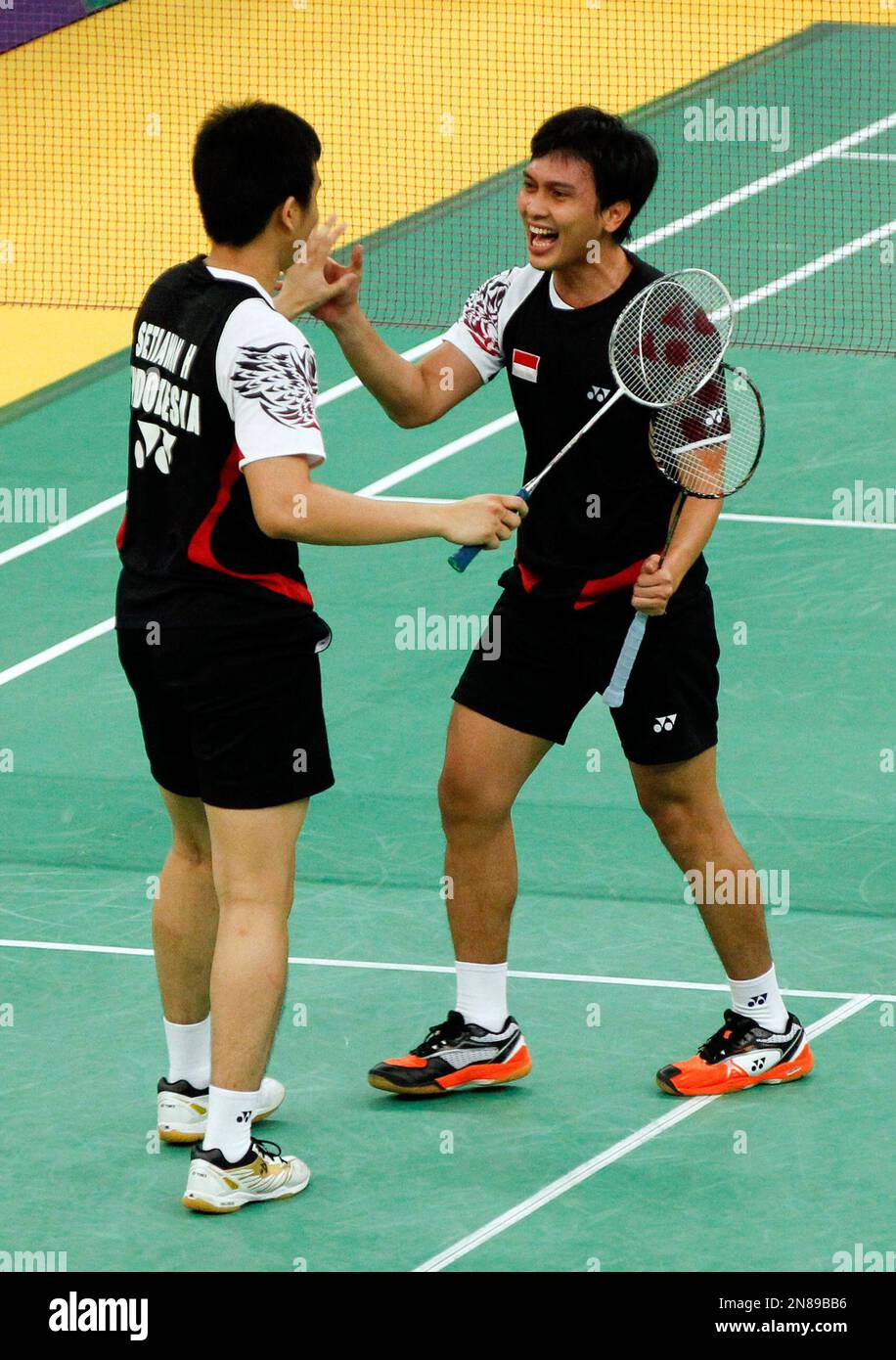 Indonesia's Hendra Setiawan, left, celebrates with his teammate ...