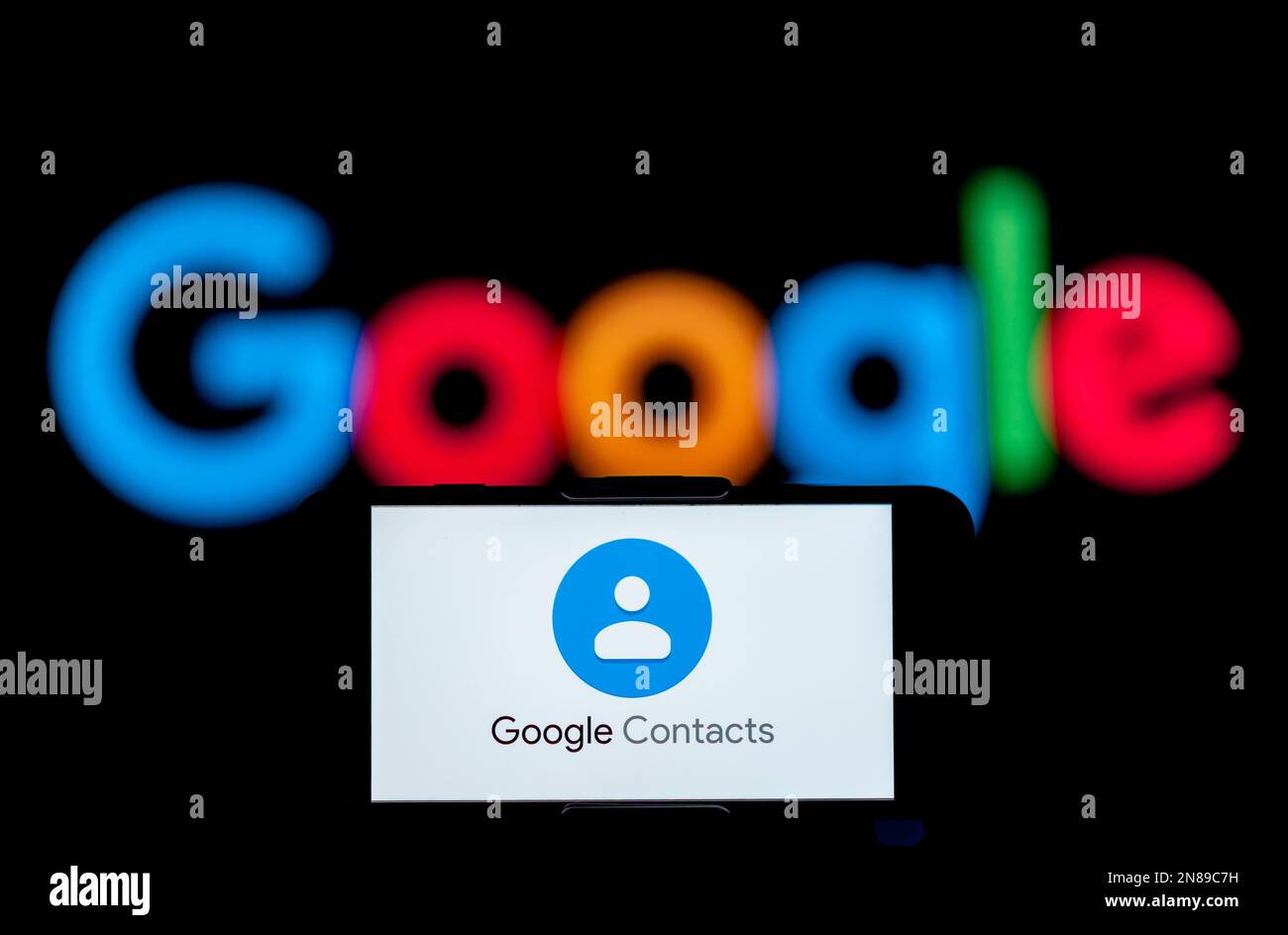 In this photo illustration, the logo of google contacts is seen ...