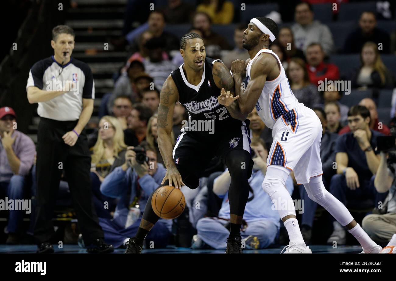 Sacramento Kings' James Johnson, left, drives on Charlotte Bobcats ...