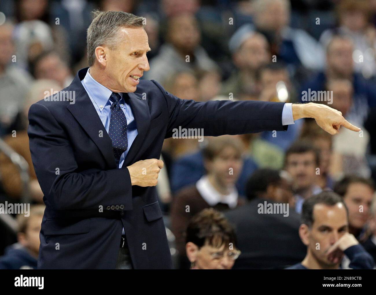 Charlotte Bobcats head coach Mike Dunlap directs his team against the ...