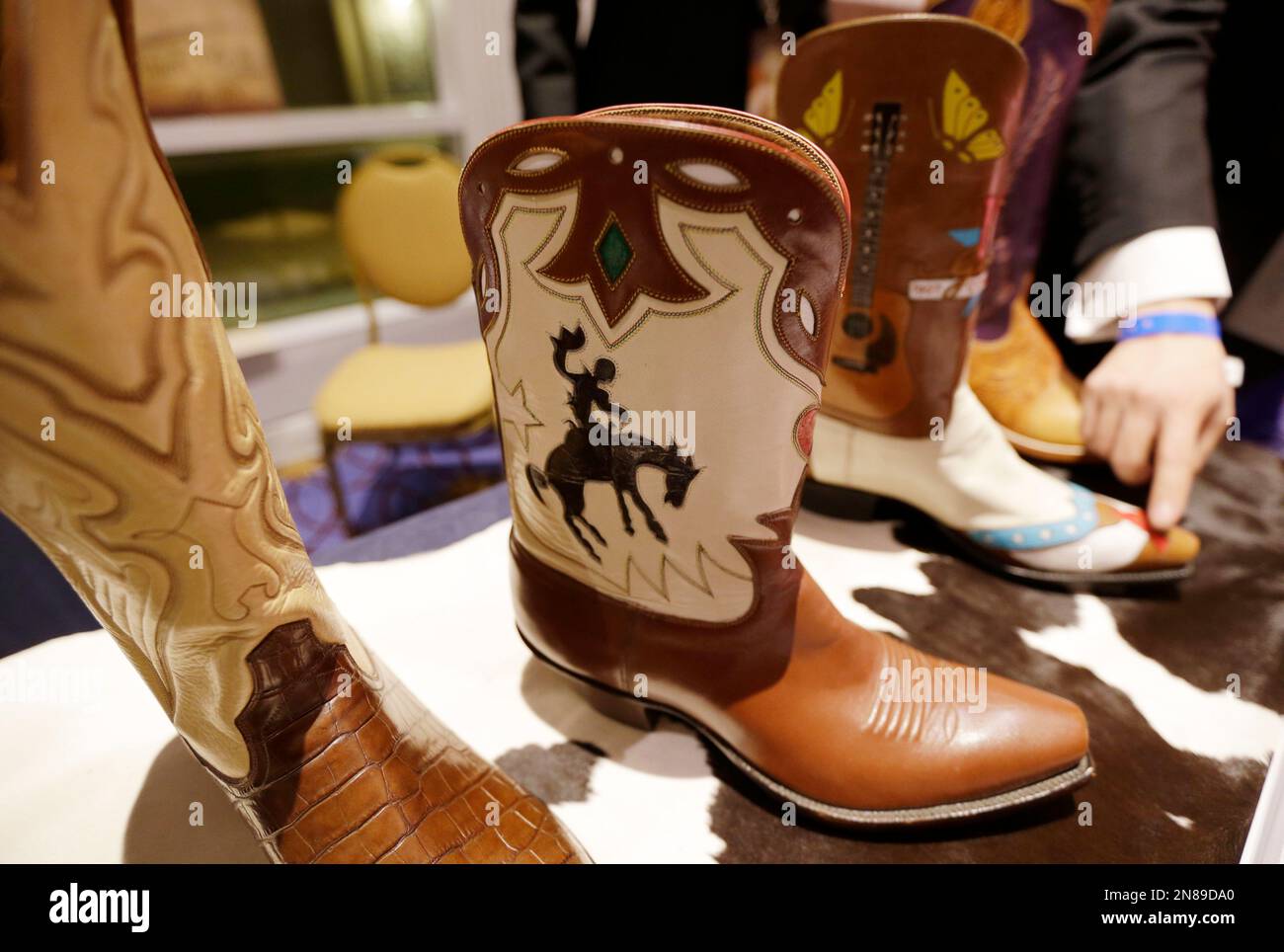 Cowboy boots are displayed during the Texas State Society's Black Tie ...
