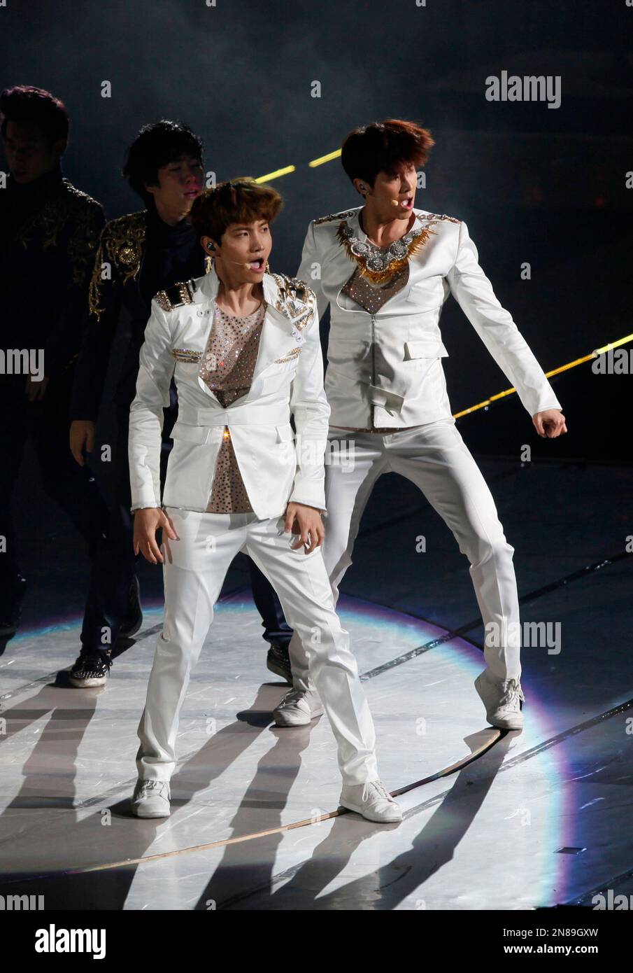 Members of South Korean boy band TVXQ perform during their concert ...