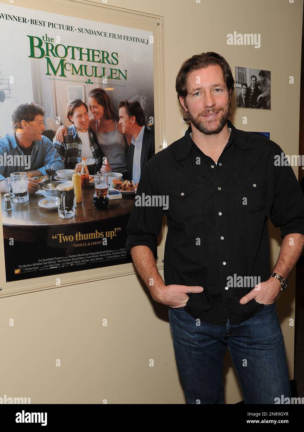 Filmmaker Ed Burns poses in front of a poster for his first film "The ...