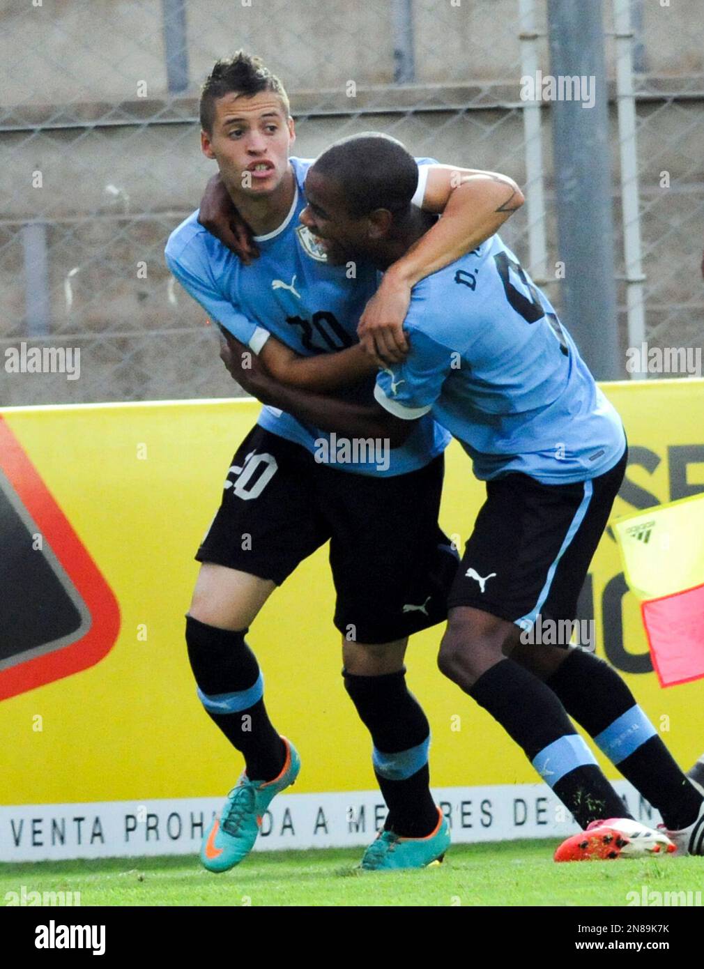 Uruguay's Nicolas Lopez, left, celebrates with teammate Diego Rolan ...