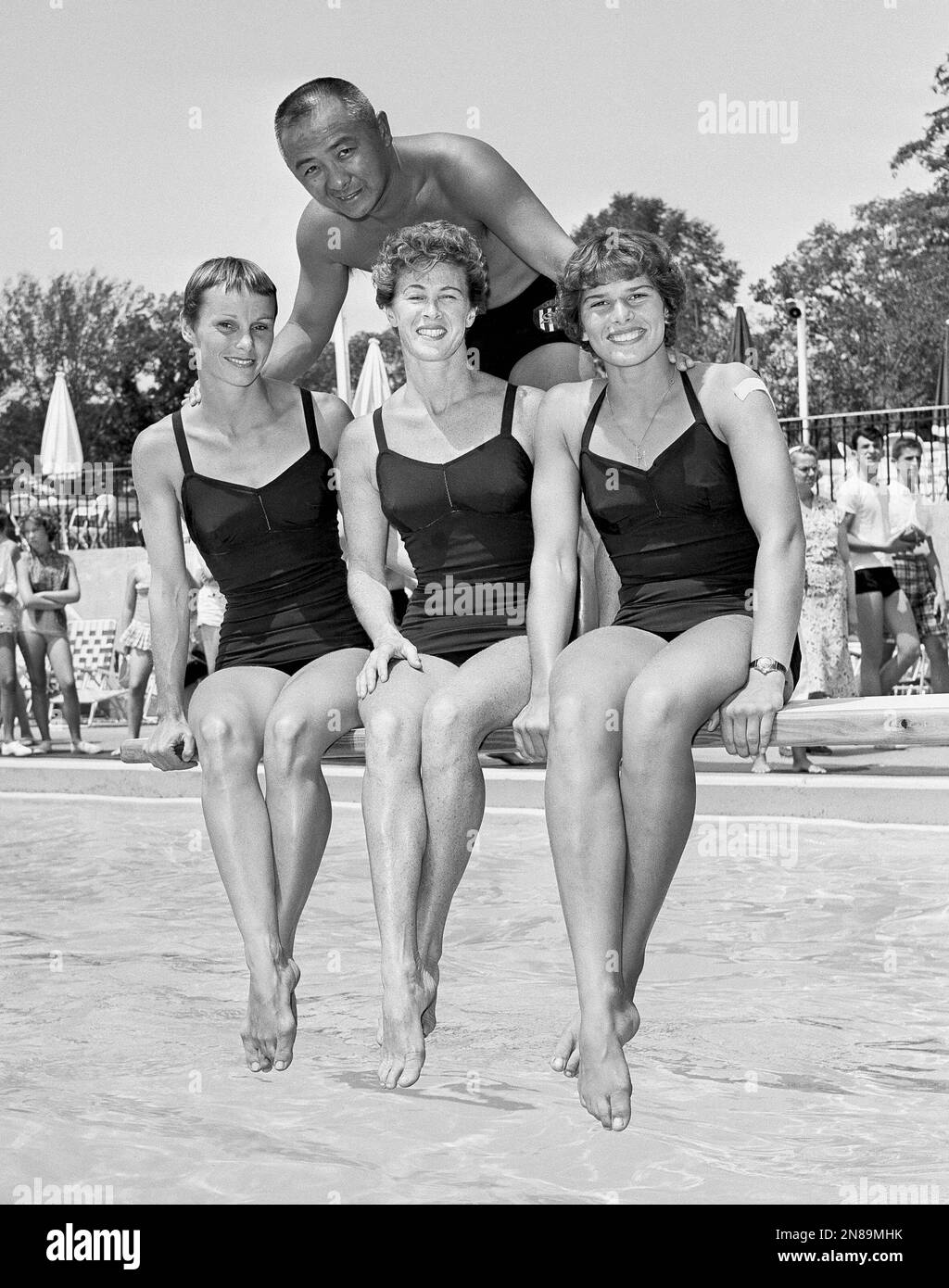 Two-time Olympic champion Sammy Lee of Santa Ana, Calif., stands behind ...