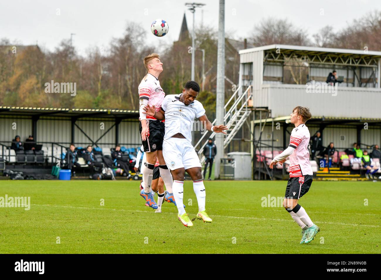Swansea, Wales. 11 February 2023. Boyd Beacroft of Reading jumps above ...