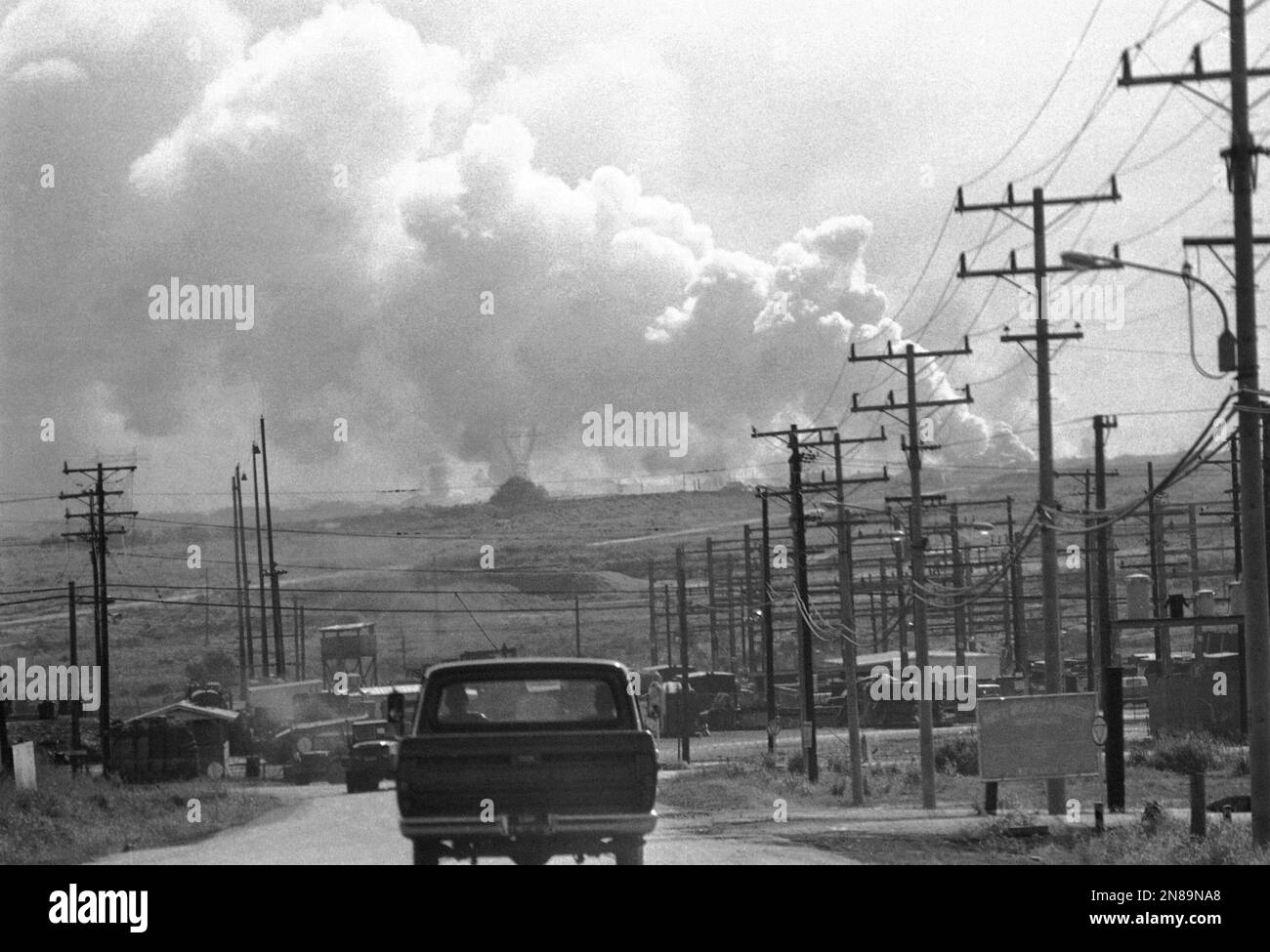 Smoke rises from an exploding south Vietnamese ammunition depot on ...