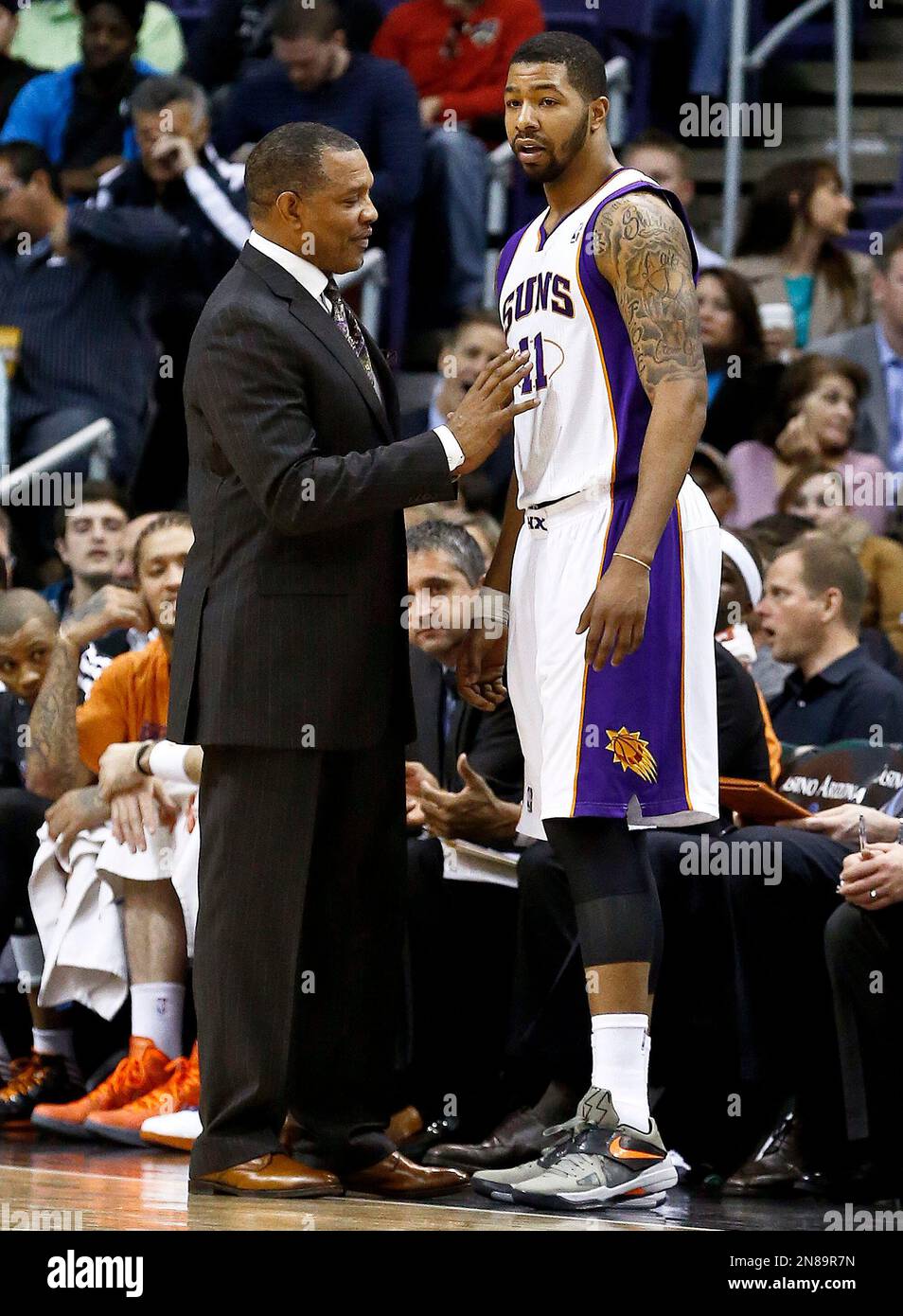 Phoenix Suns head coach Alvin Gentry, left, talks with Markieff Morris ...