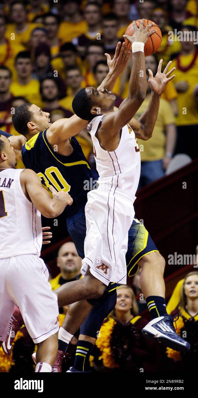 Minnesota forward Andre Ingram (30) has his shot blocked by Michigan ...