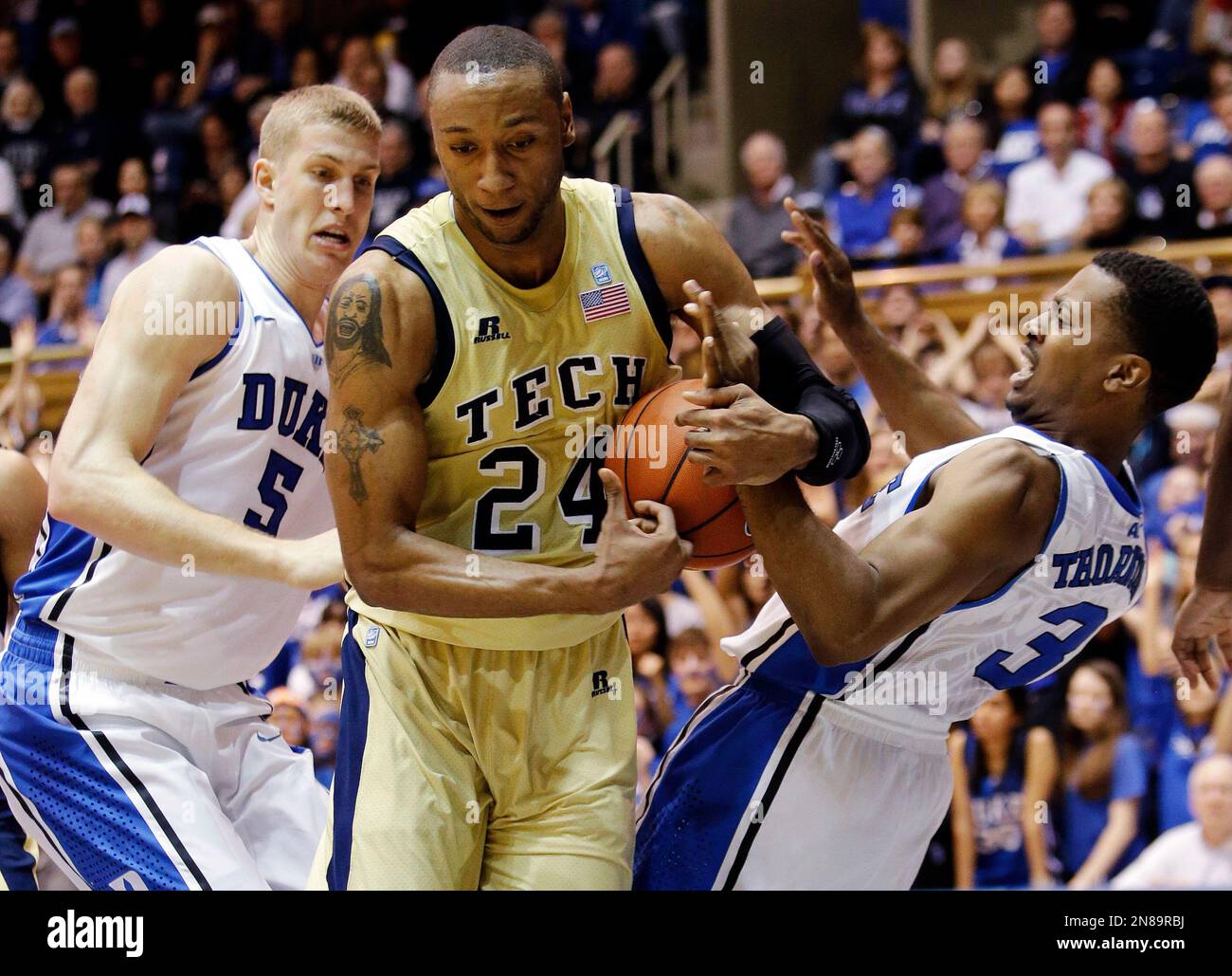 Duke's Mason Plumlee (5) and Tyler Thornton (3) struggle with Georgia ...