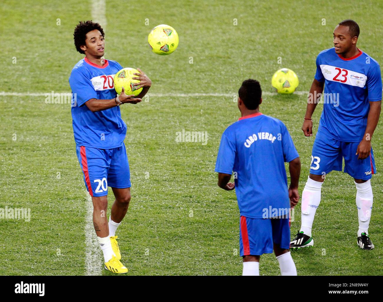 Cape Verde's Ryan Mendes, left, catches a ball as teammate Carlitos ...