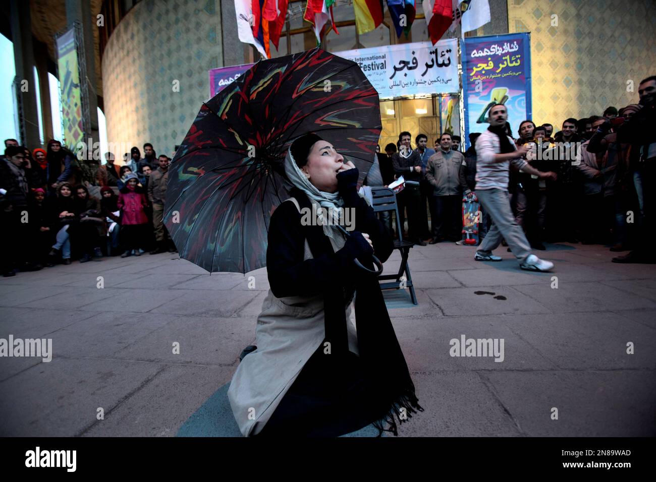 Iranian actress Elaheh Pourjamshid, foreground, and actor Mohammad Hadi ...