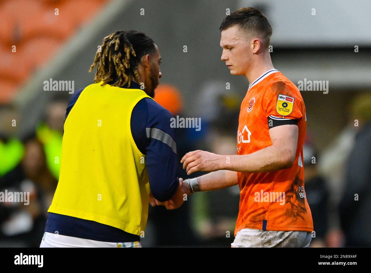 Andy Lyons #24 of Blackpool shaking hands with Dominic Thompson #23 of ...