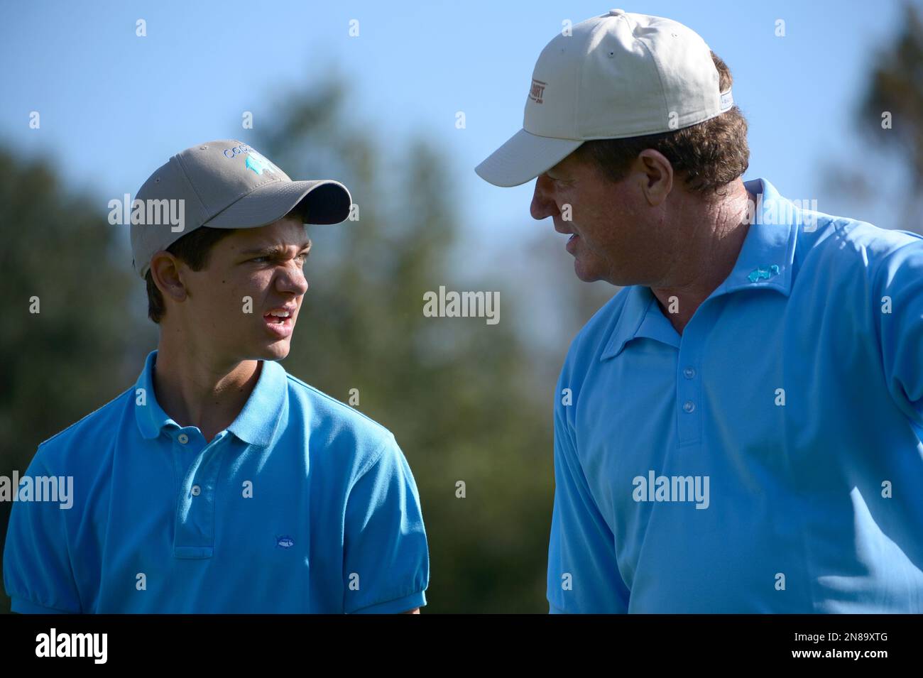 Steve Elkington, right, of Australia, talks with his son Sam Elkington ...