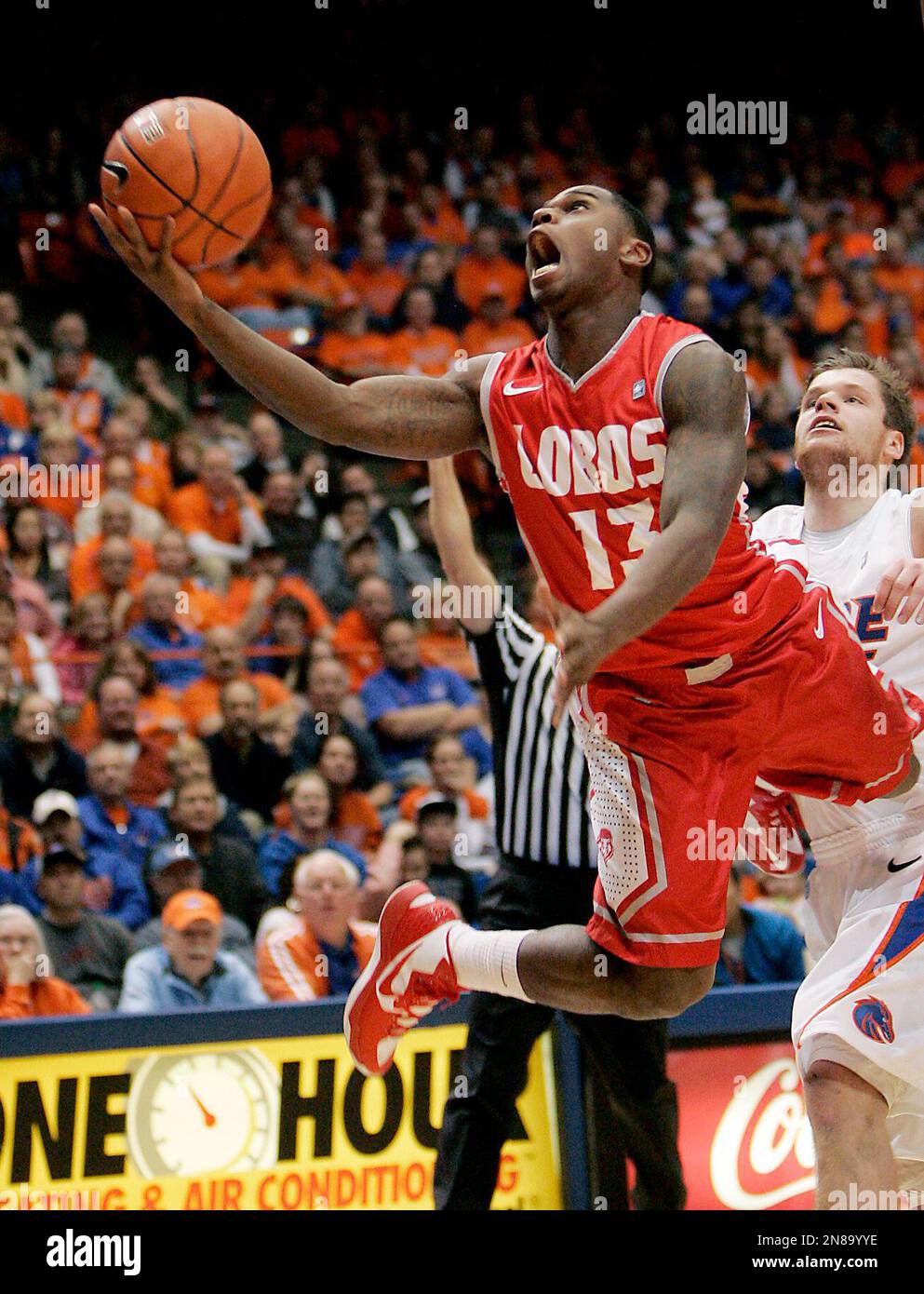 New Mexico's Jamal Fenton (13) drives the lane against Boise State ...