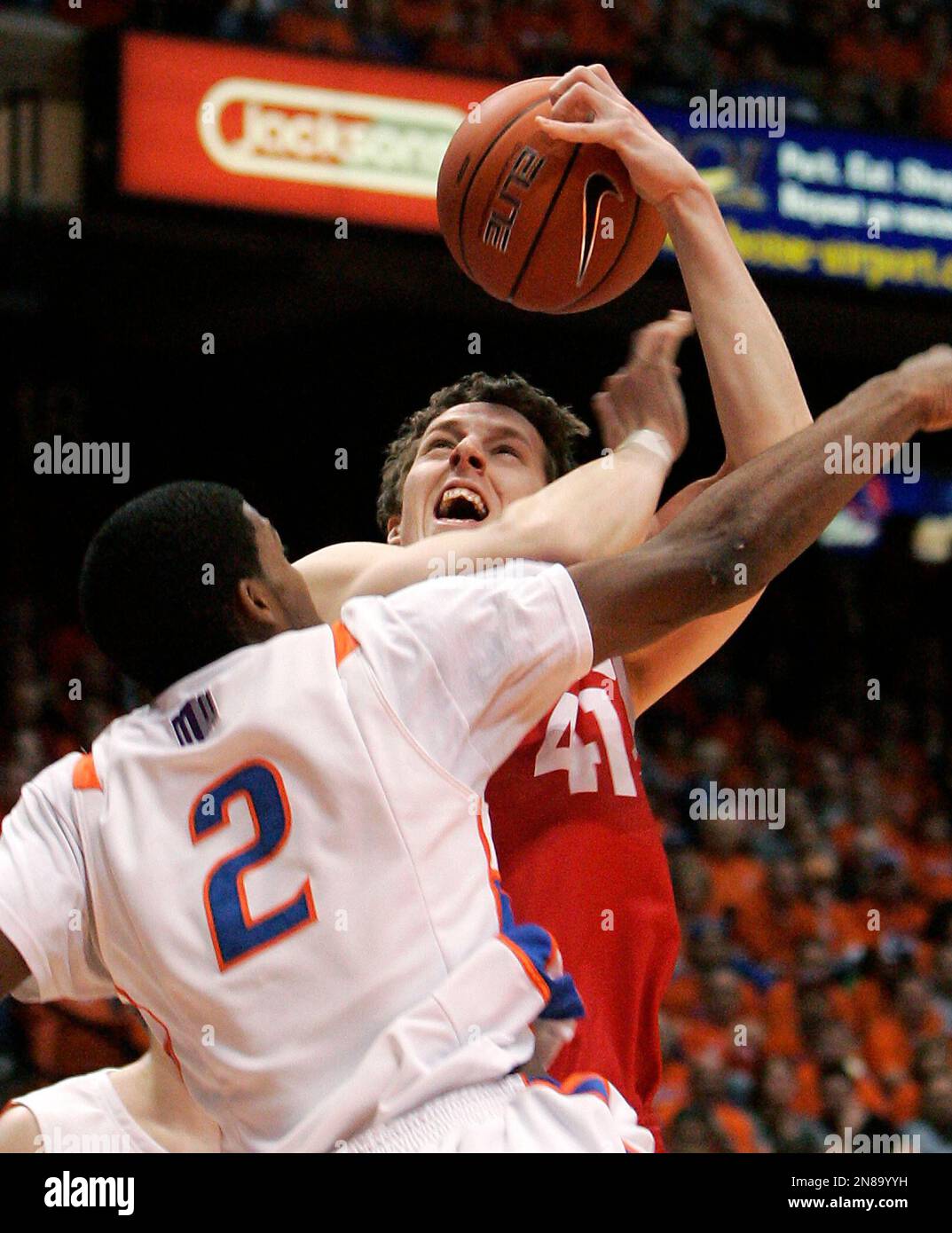 New Mexico's Cameron Bairstow (41) shoots past Boise State's Derrick ...