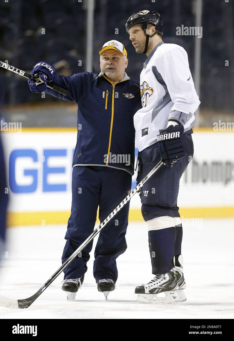 Nashville Predators head coach Barry Trotz, left, talks with right wing ...