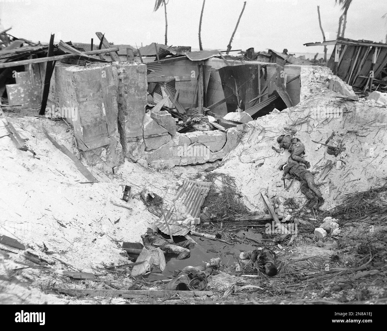 Dead Japanese soldiers where they fell near a concrete pillbox that was ...