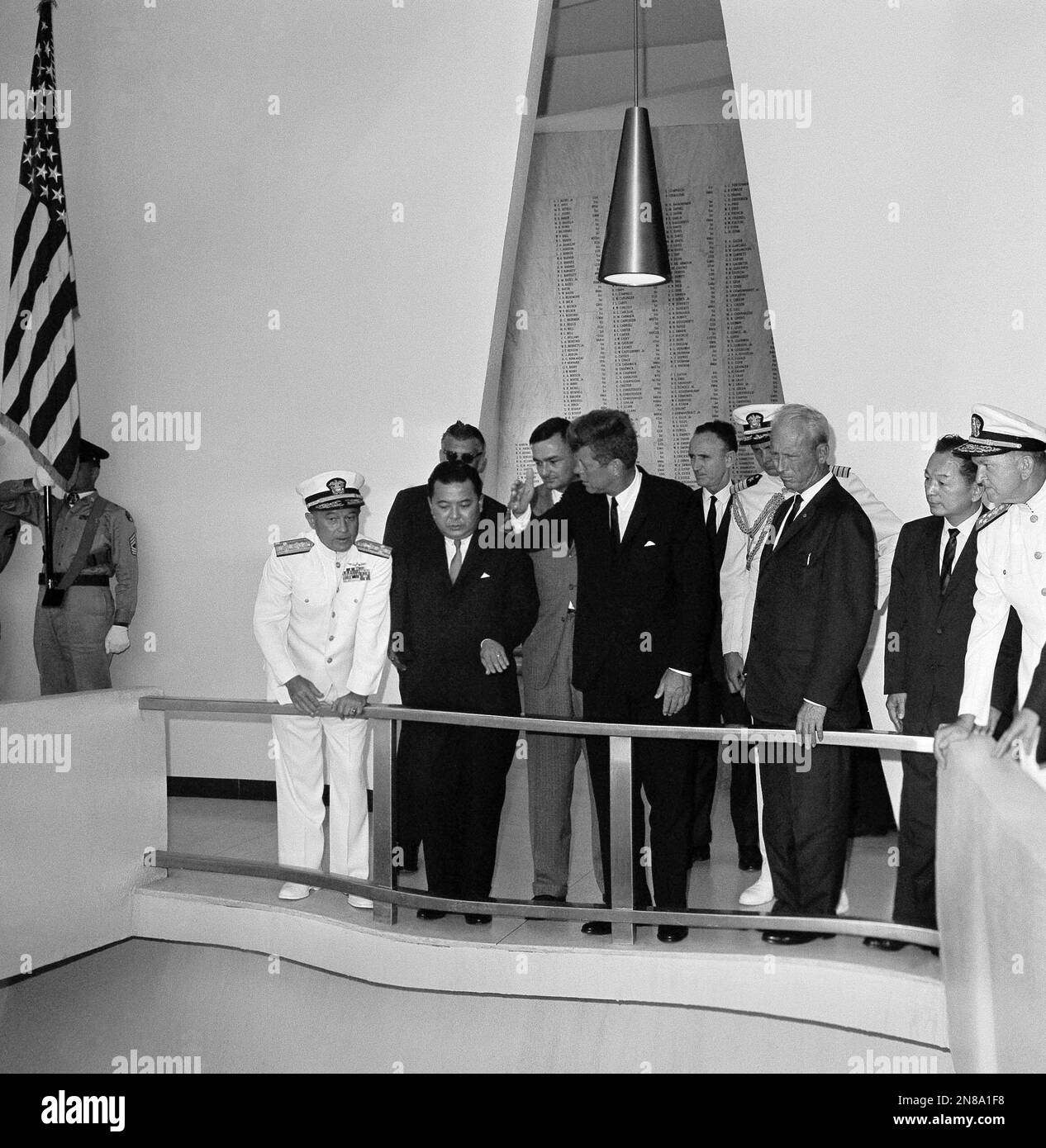 President John F. Kennedy, center, gestures as he looks over the ...