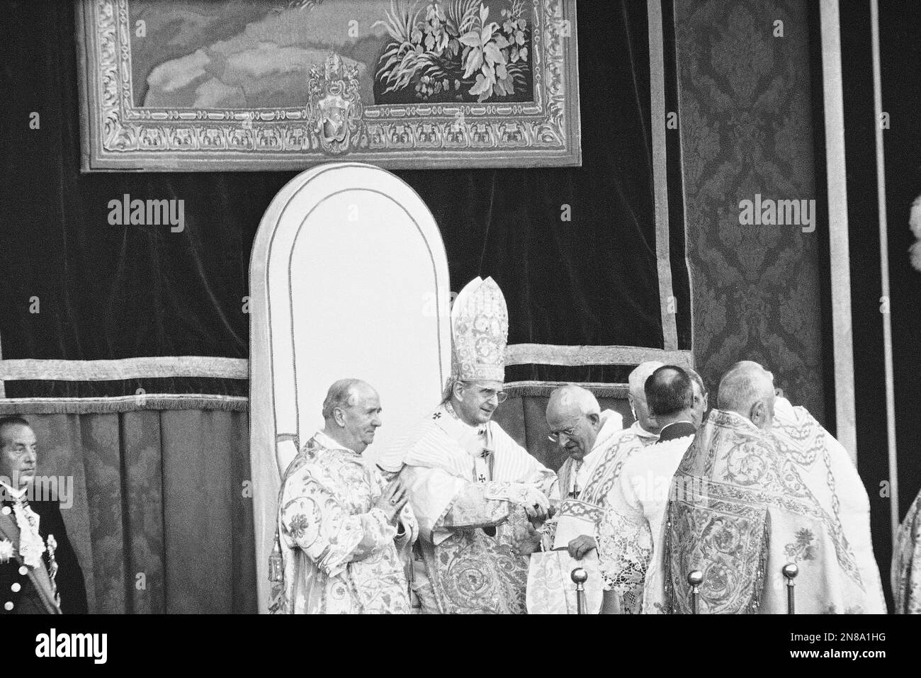 Pope Paul VI, seated on throne in front of the main entrance to St ...