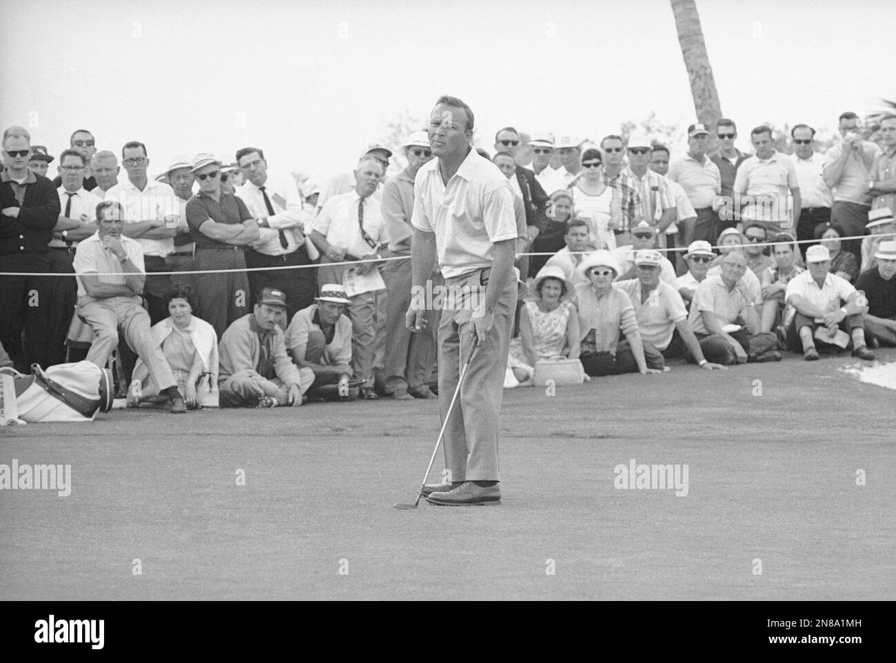 Arnold Palmer shows his feelings on missing a putt on the 14th green in ...