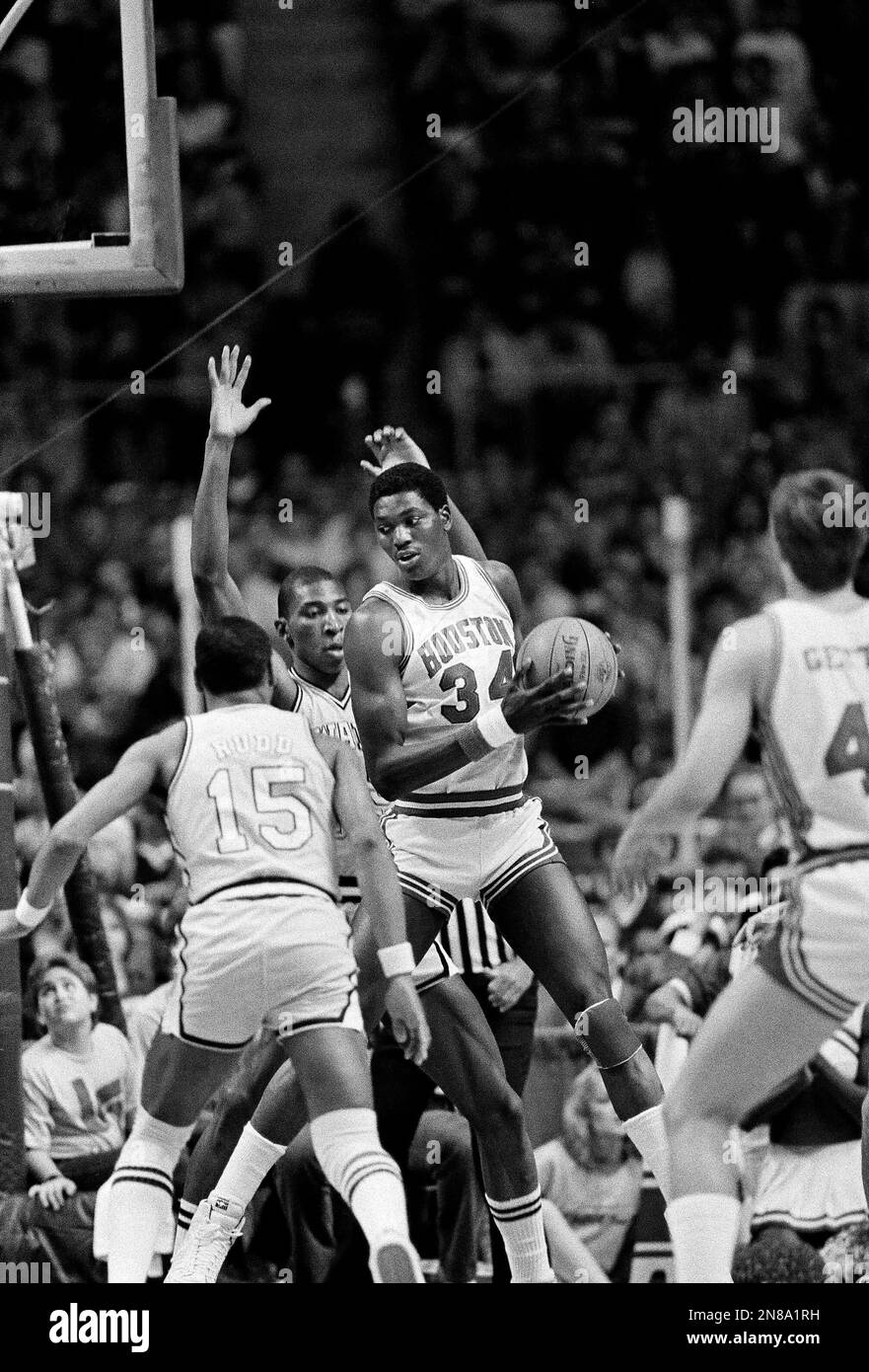 University of Houston's Akeem Abdul Olajuwon pulls in the basketball as ...