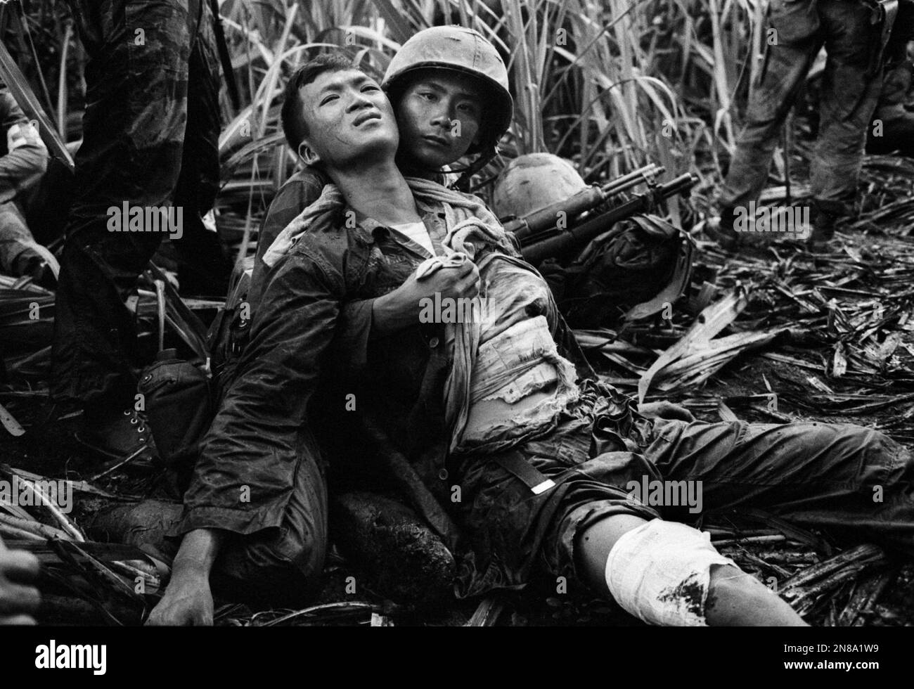 A South Vietnamese Marine, severely wounded in a Viet Cong ambush, is ...