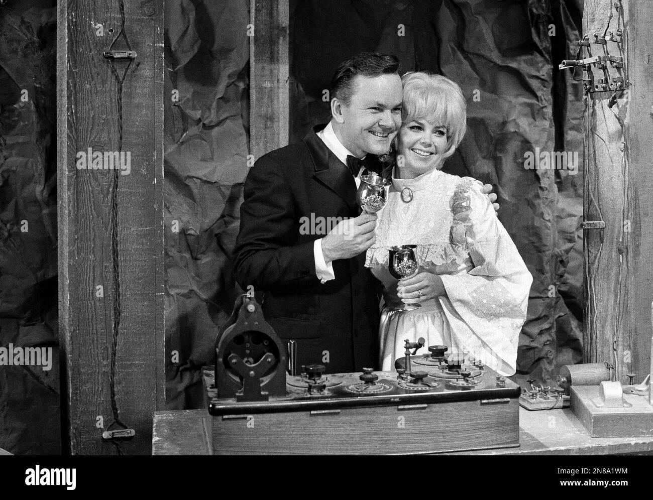 Bob Crane, star of the TV series "Hogan's Heroes," toasts his bride, actress Sigrid Valdis, who ...