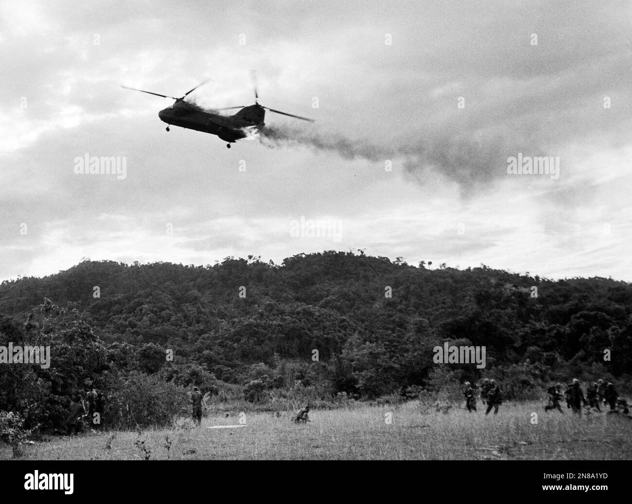 A U.S. Marine CH-46 Sea Knight helicopter comes down in flames after ...