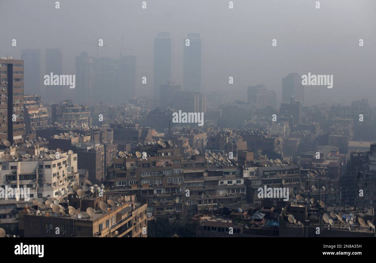 Residential buildings are obscured by heavy air pollution in Cairo ...