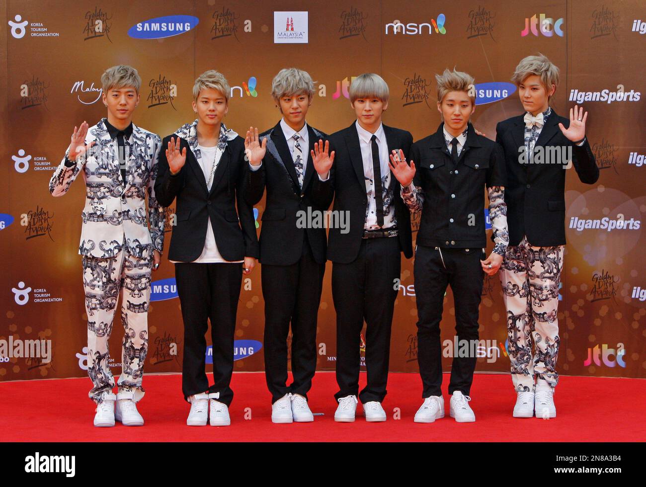 South Korean boy band B.A.P pose for photographers as they arrive on the red carpet ahead of the ...