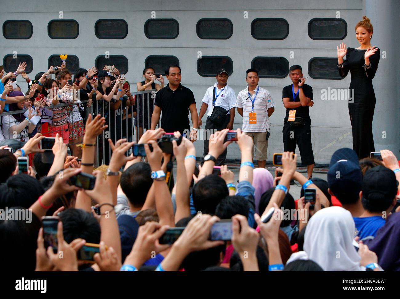 South Korean singer Ailee waves to fans as she arrives on the red carpet ahead of the 27th ...