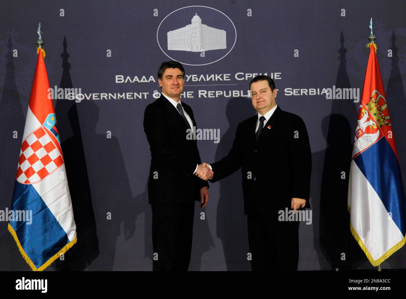 Serbian Prime Minister Ivica Dacic, right, welcomes his Croatian ...