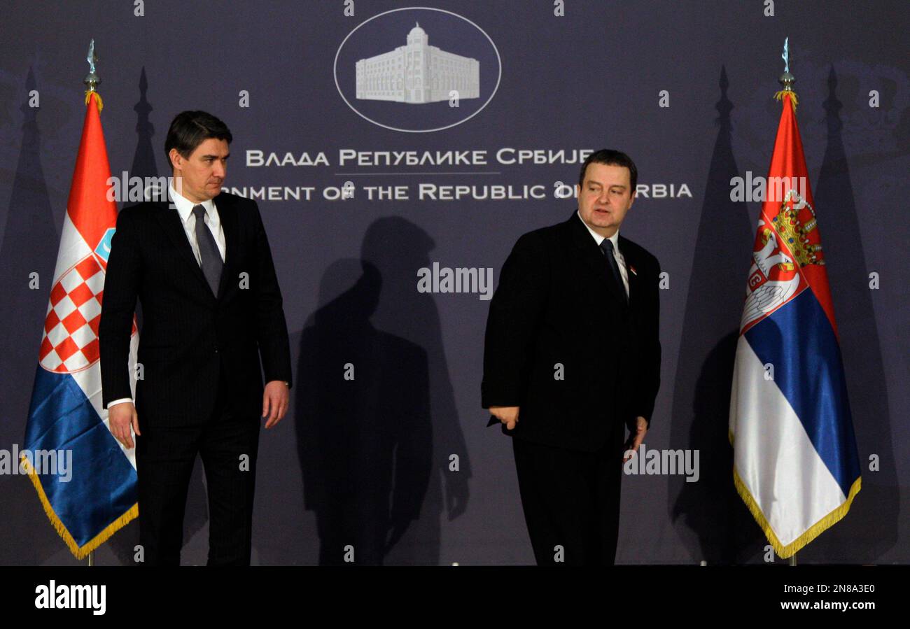 Serbian Prime Minister Ivica Dacic, right, welcomes his Croatian ...