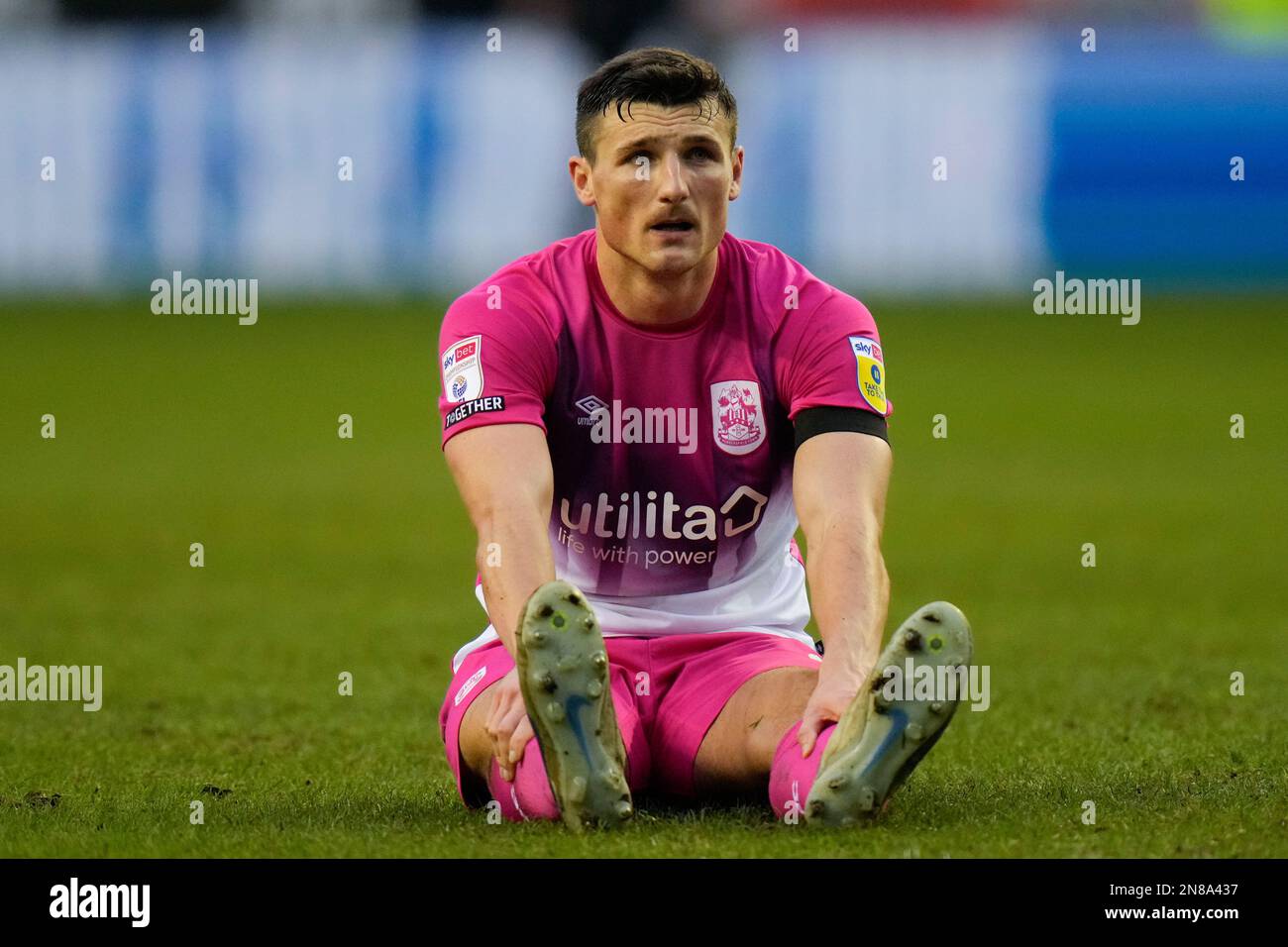Matty Pearson #4 of Huddersfield Town reacts after their sides defeat 0 ...