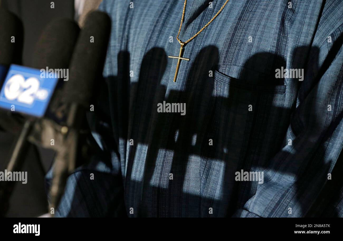 A cross hangs around the neck of Alton Logan who was wrongly convicted ...