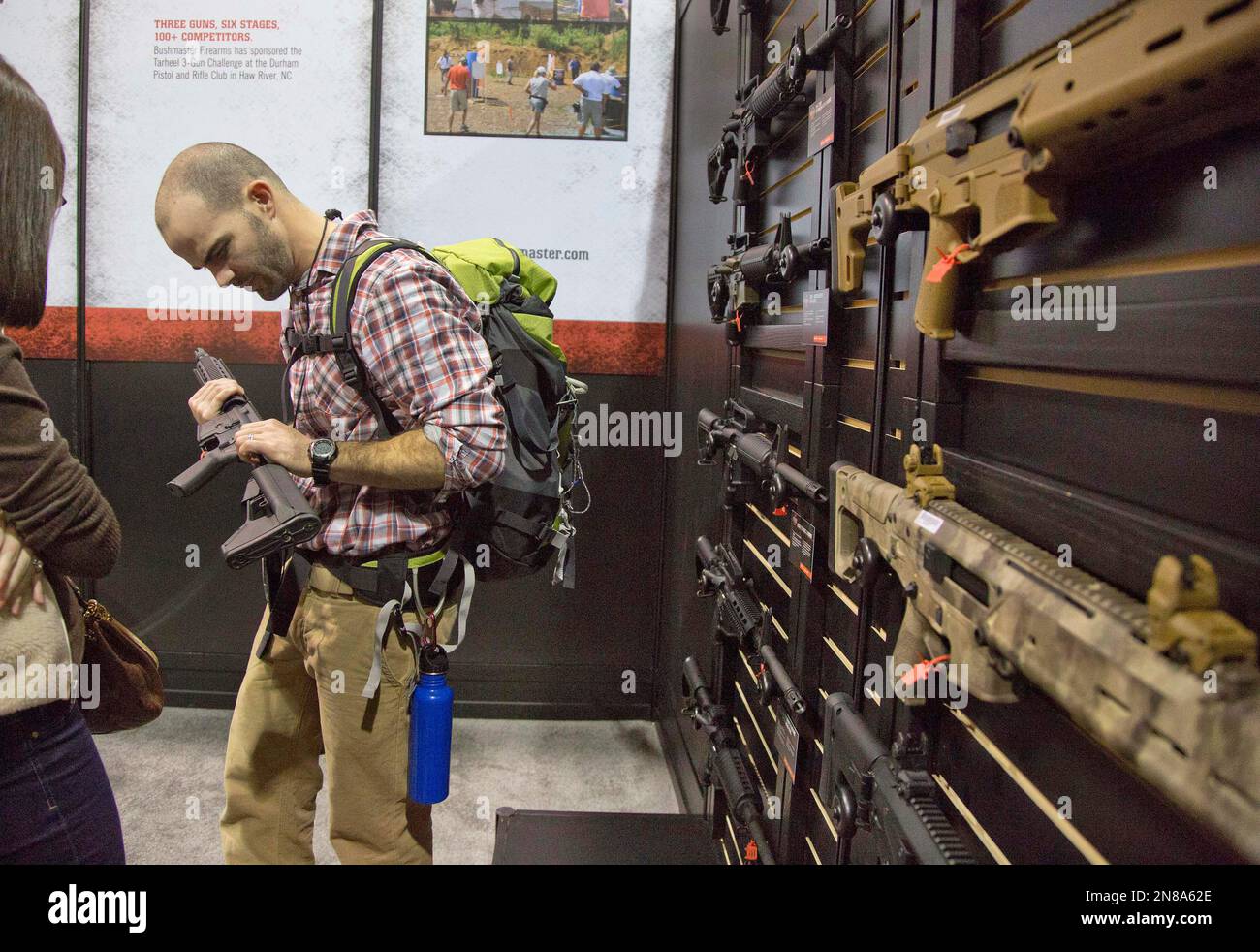 Will Michaels of Homer, La., examines a Bushmaster M4 A3 Carbine 300 ...