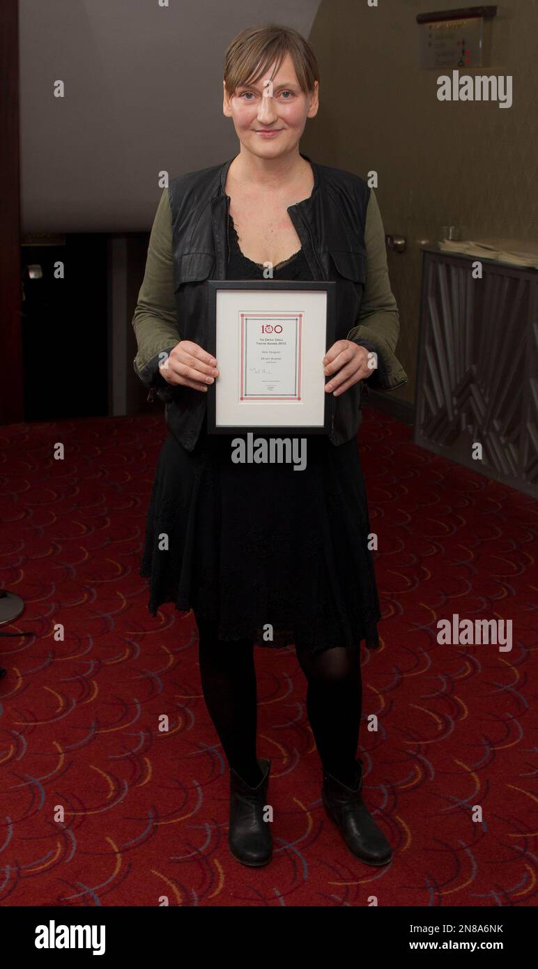 Miriam Buether holds her Best Designer Award for Wild Swans, following ...