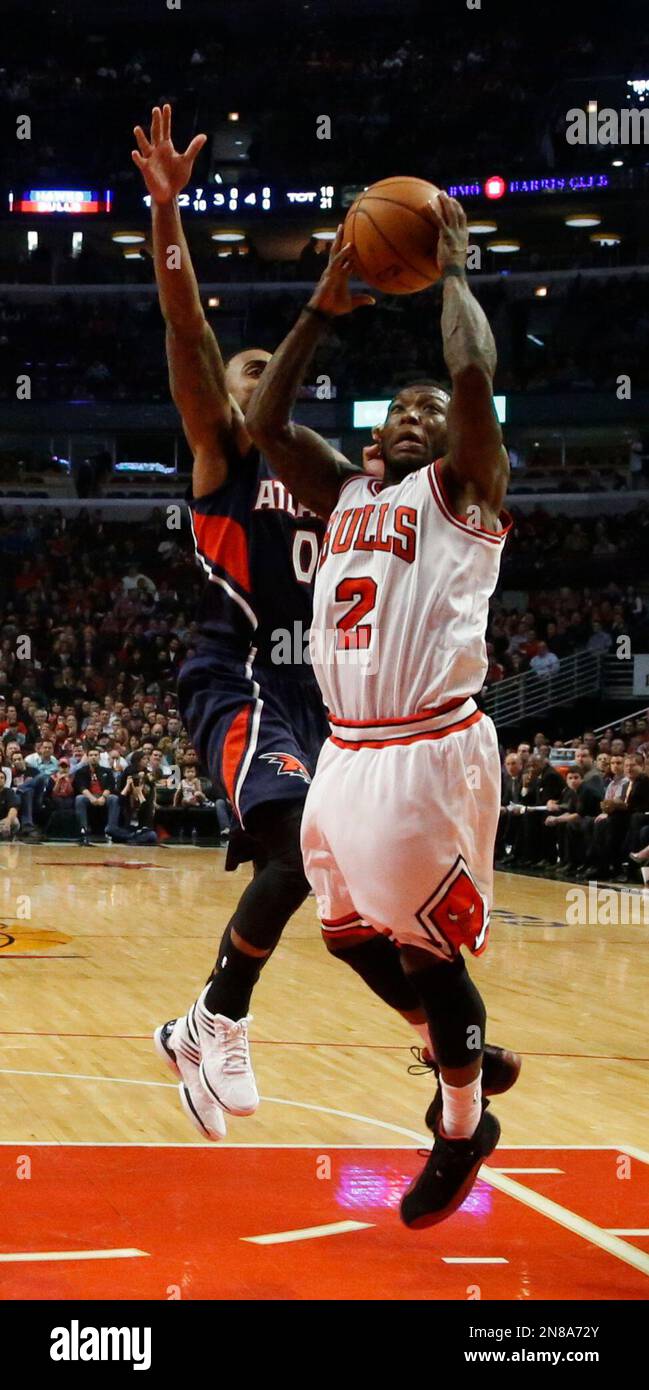 Chicago Bulls point guard Nate Robinson (2) shoots past the out ...