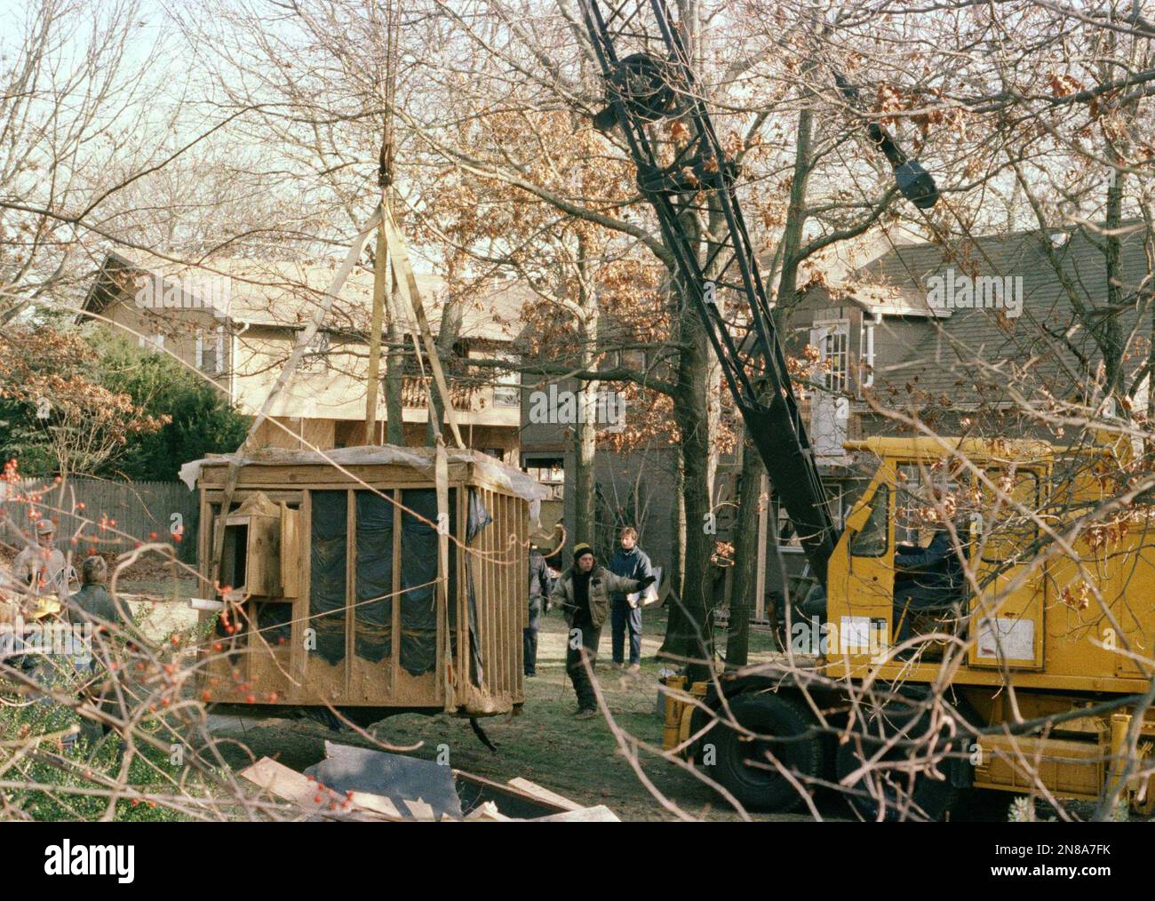 FILE - In this Jan. 18, 1993 file photo, a crane raises a 6 foot by 9 ...
