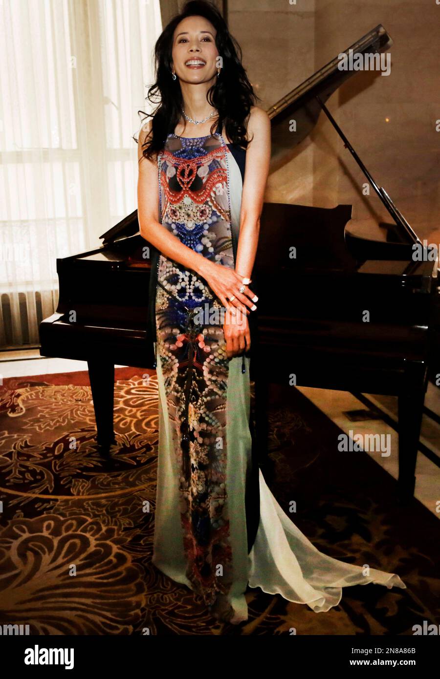 Hong Kong singer Karen Mok poses for photographers during her global ...