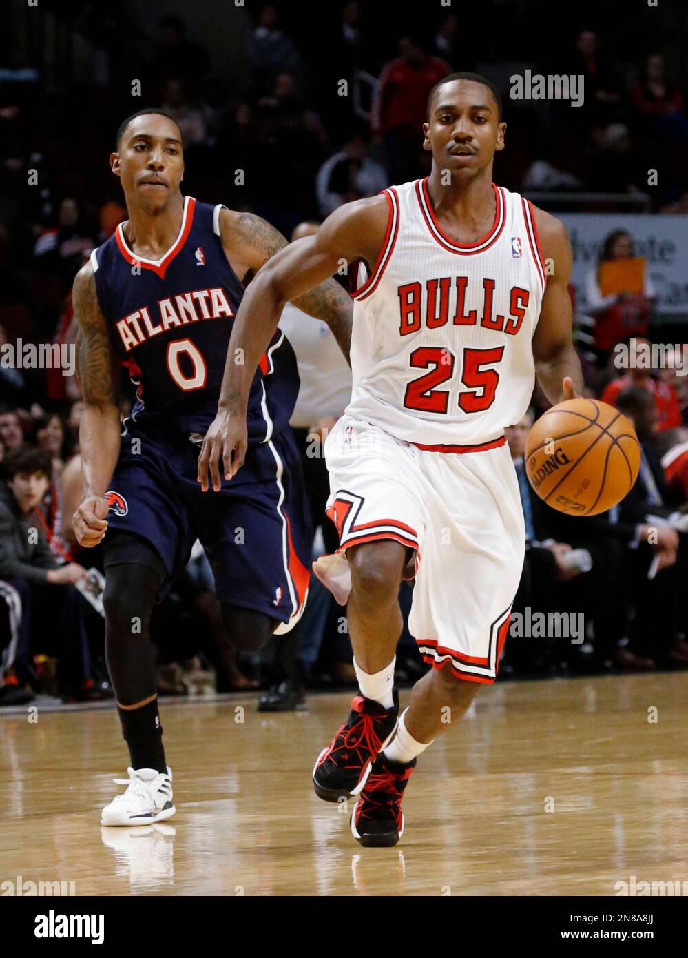 Chicago Bulls guard Marquis Teague (25) drives past Atlanta Hawks guard ...