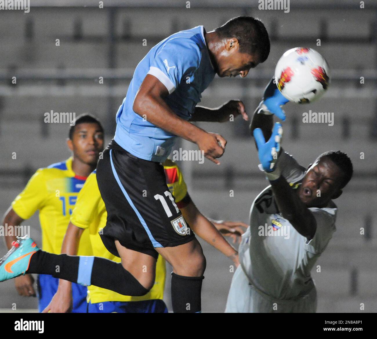 Uruguay's Rodrigo Aguirre heads to score as Ecuador's goalkeeper Darwin Cuero tries to block ...