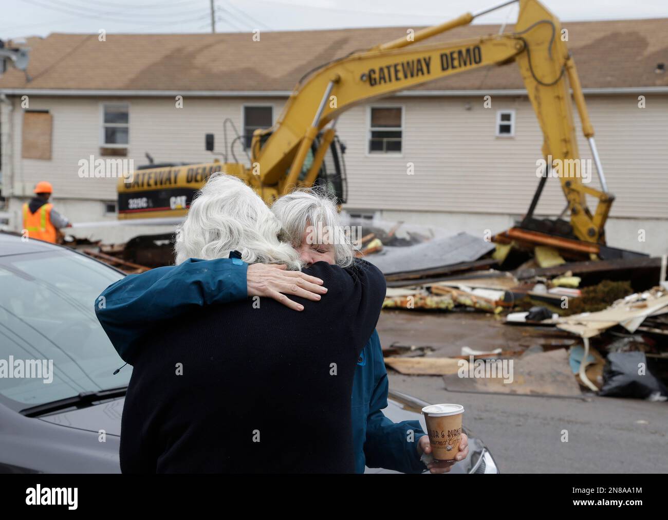 Mickey Merrell, right, hugs her sister Ronnie Loesch after watching ...